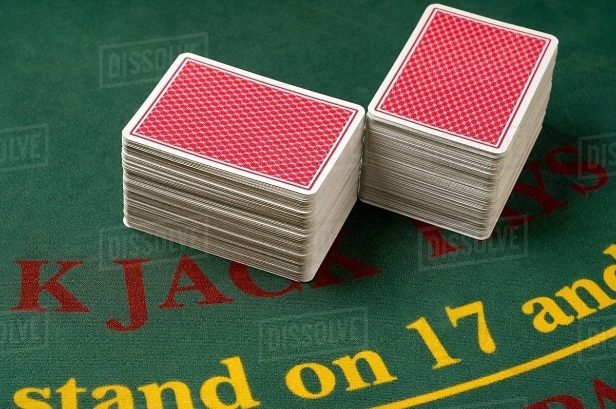 Stacked playing cards in a casino - Royalty-free Stock Photo | Dissolve