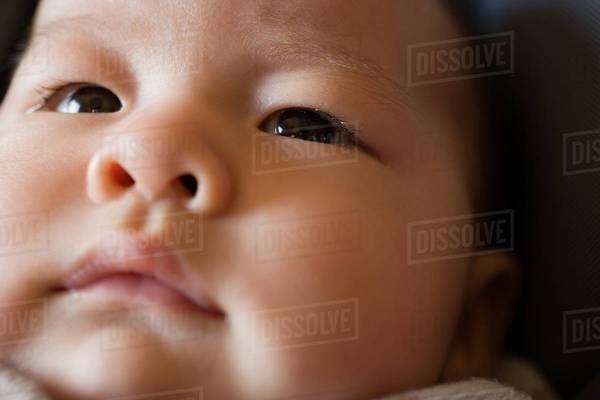 Face of a baby - Stock Photo - Dissolve
