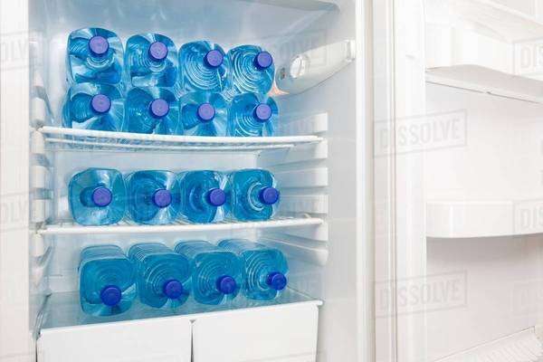 Bottles of water in a fridge - Royalty-free Stock Photo | Dissolve