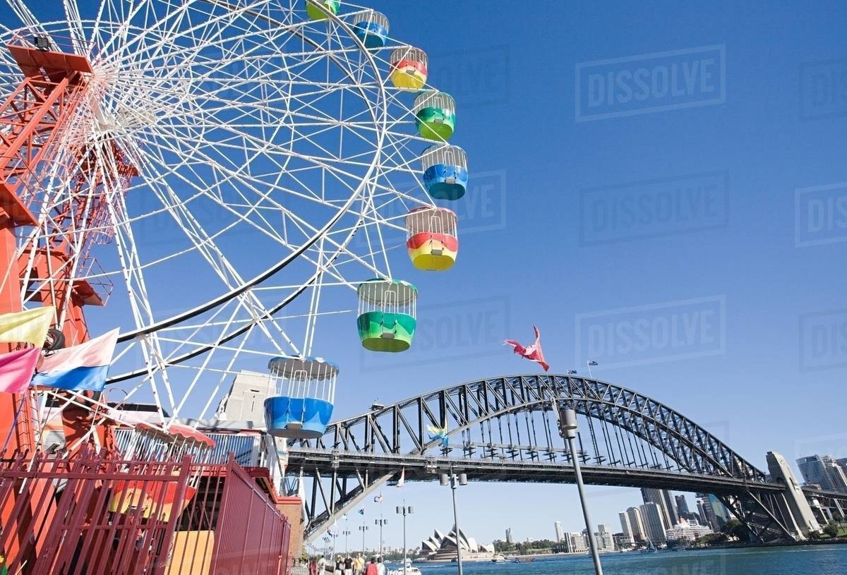 A ferris wheel and sydney harbour bridge - Royalty-free Stock Photo ...