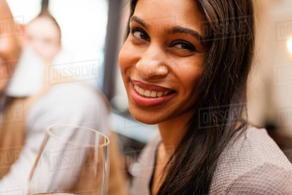 Woman smiling coyly - Stock Photo - Dissolve