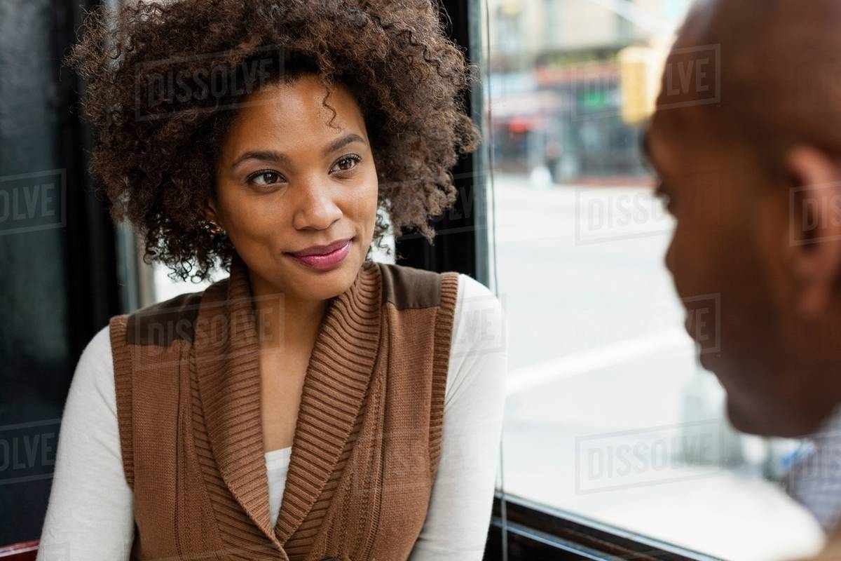 Woman looking intently at man - Royalty-free Stock Photo | Dissolve