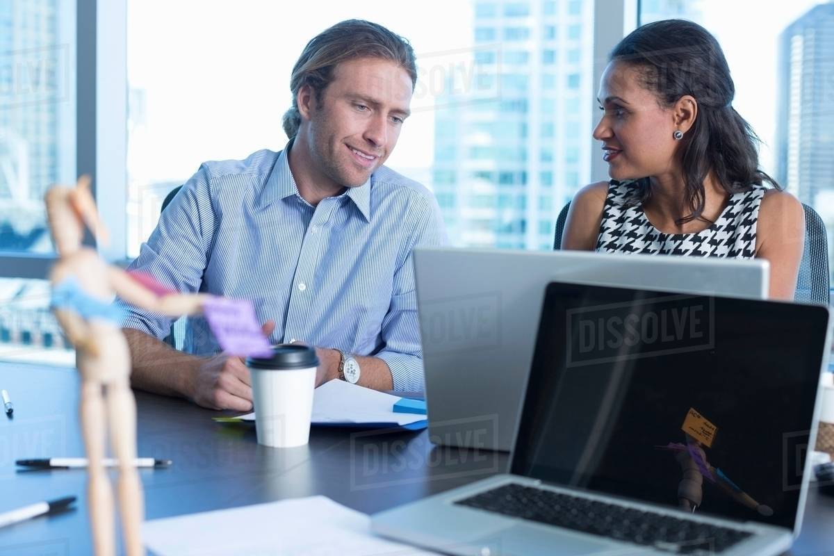 Business people working at desk - Stock Photo - Dissolve