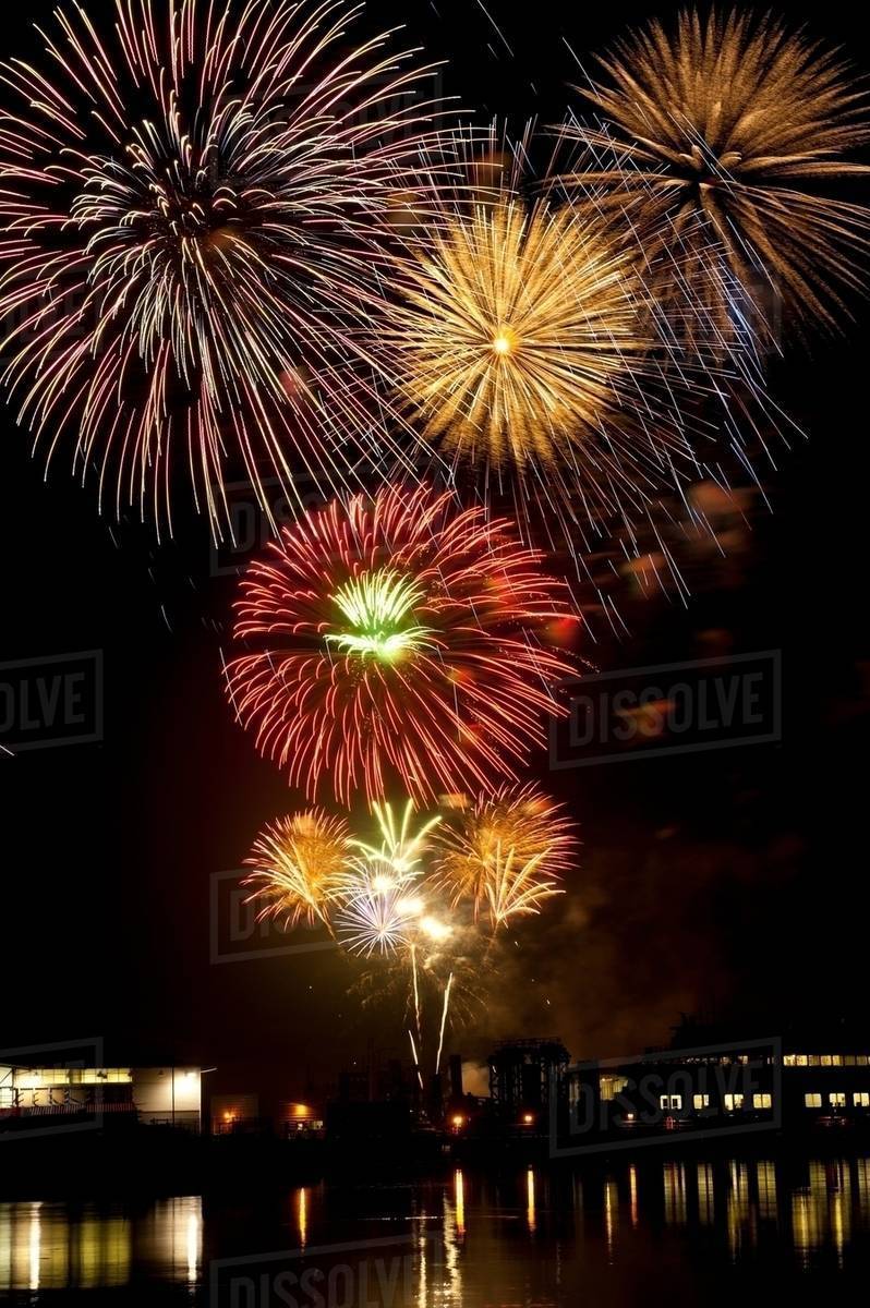Firework display over water - Royalty-free Stock Photo | Dissolve
