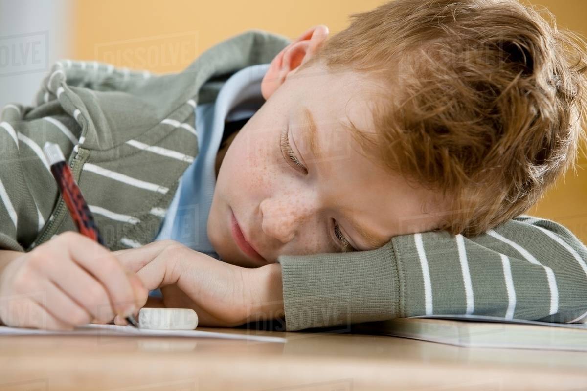 Boy writing - Royalty-free Stock Photo | Dissolve