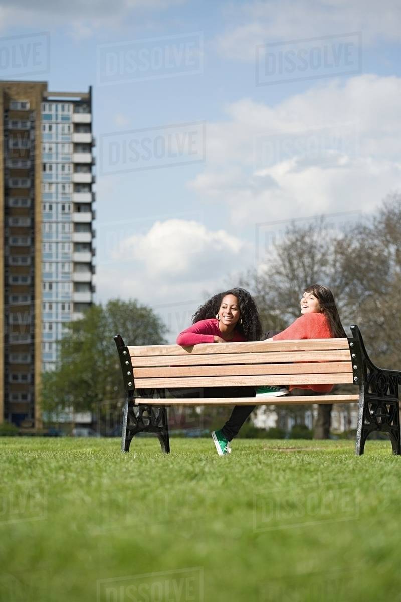 Teenage girls on bench - Royalty-free Stock Photo | Dissolve