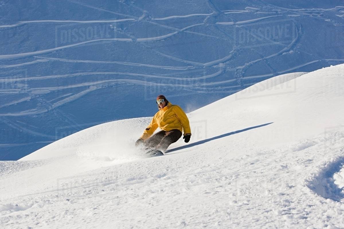 A man snowboarding - Stock Photo - Dissolve