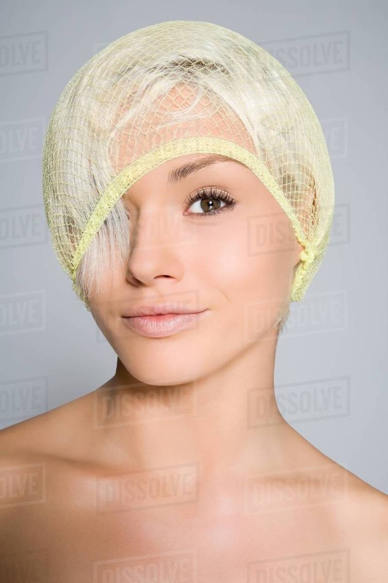 Portrait of a woman wearing a hairnet - Royalty-free Stock Photo | Dissolve