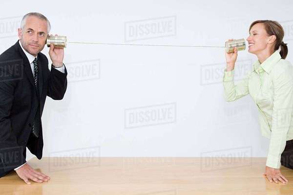 Businesspeople using a tin can telephone - Royalty-free Stock Photo ...