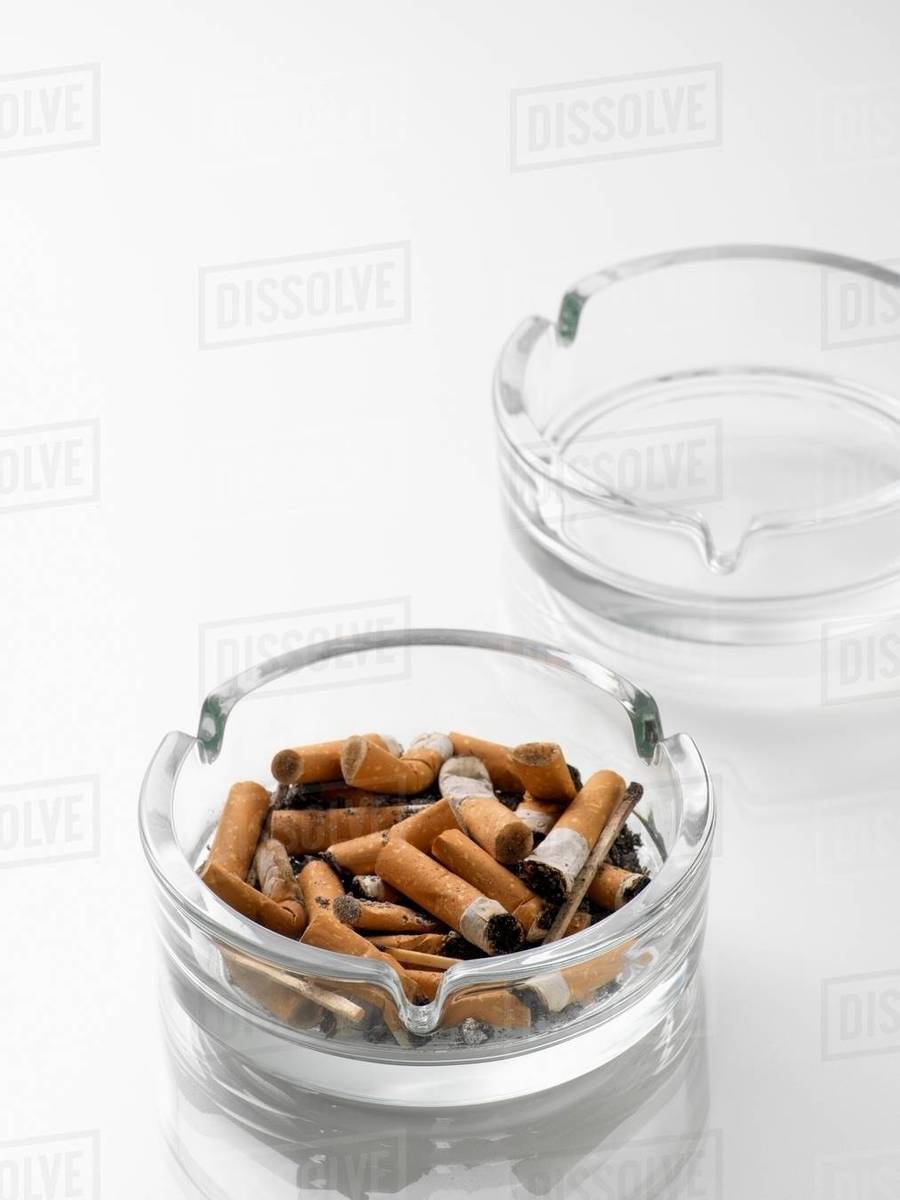 Empty and full ash tray - Royalty-free Stock Photo | Dissolve