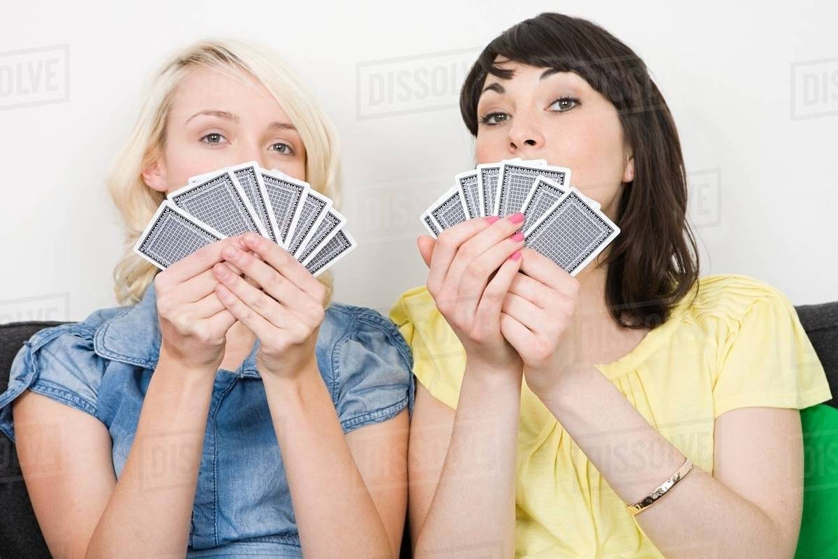 Two women playing cards - Royalty-free Stock Photo | Dissolve