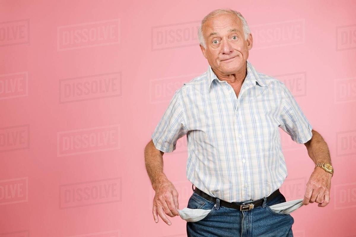 Man with empty pockets - Stock Photo - Dissolve