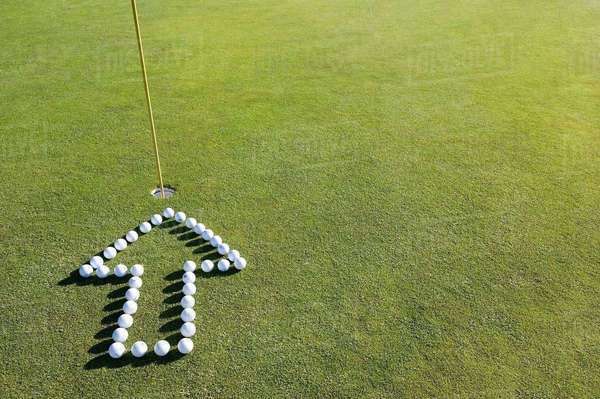 An arrow pointing to a hole on a golf green - Royalty-free Stock Photo ...