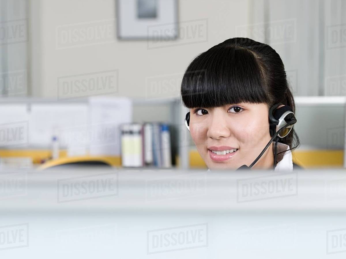 Woman wearing headset - Royalty-free Stock Photo | Dissolve