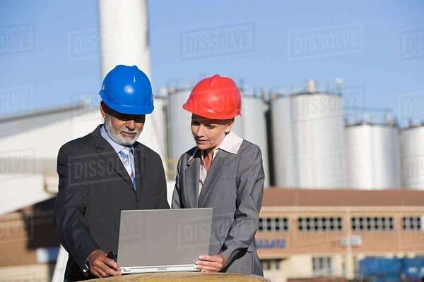 Engineers with laptop - Royalty-free Stock Photo | Dissolve