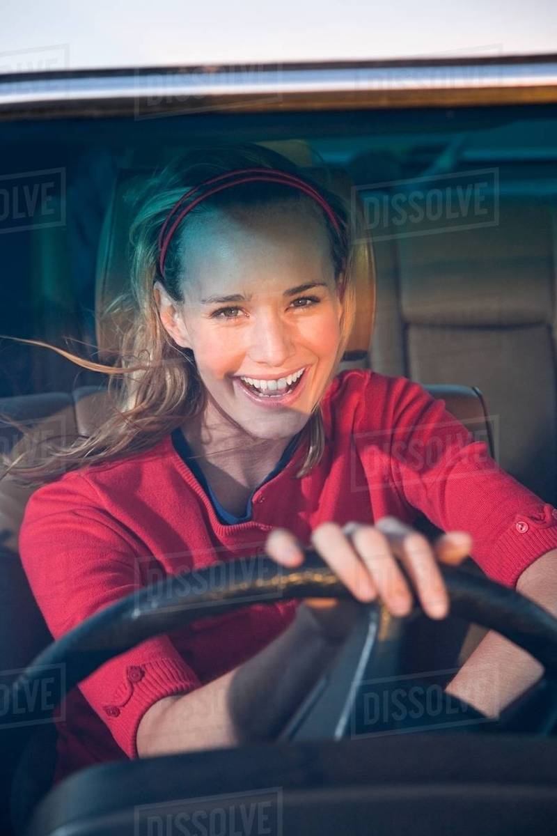 Young woman driving - Royalty-free Stock Photo | Dissolve