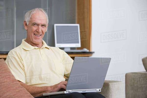 Man using laptop - Royalty-free Stock Photo | Dissolve
