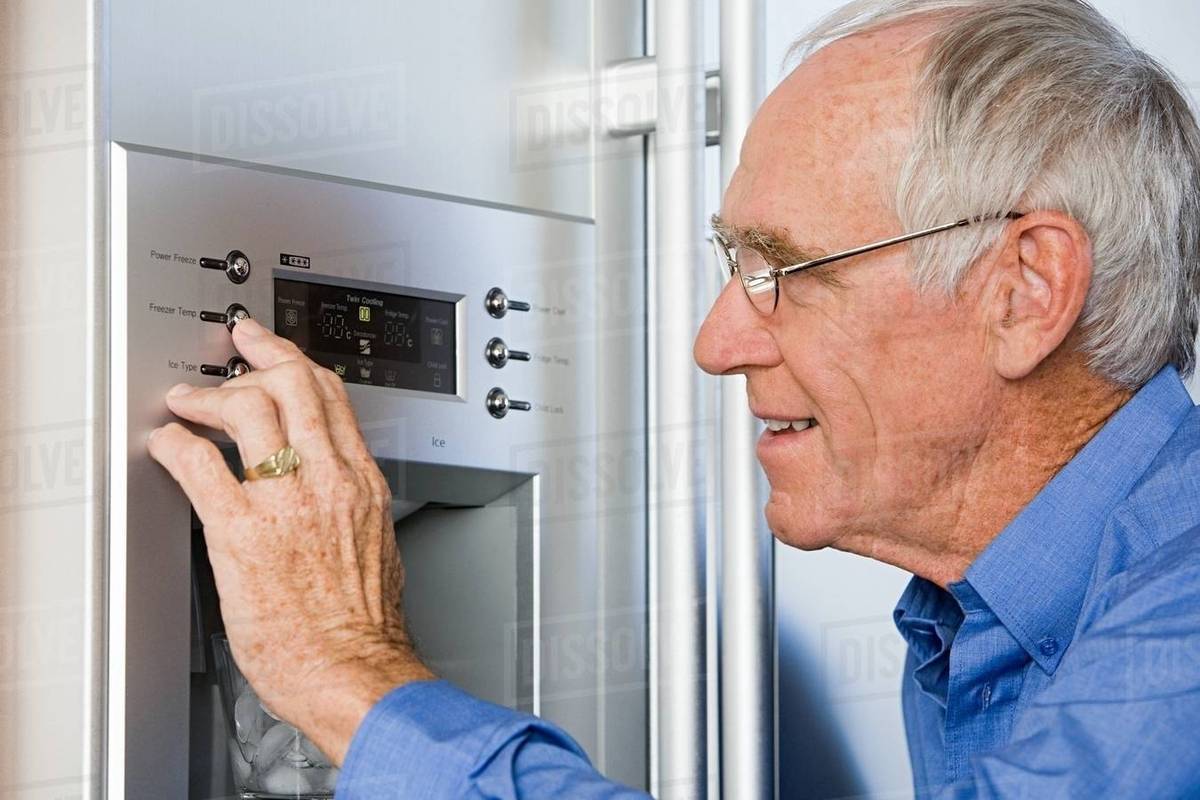 Man using refrigerator - Royalty-free Stock Photo | Dissolve