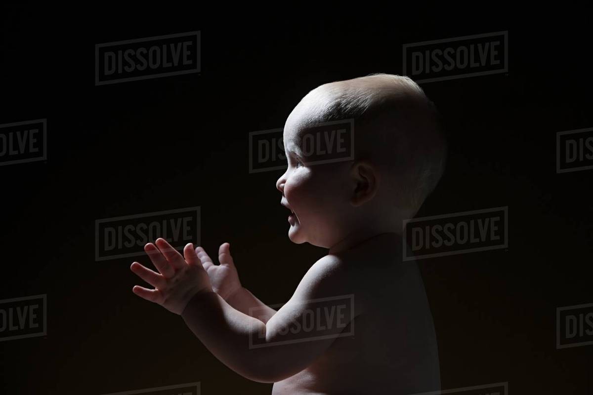 A baby boy clapping - Royalty-free Stock Photo | Dissolve