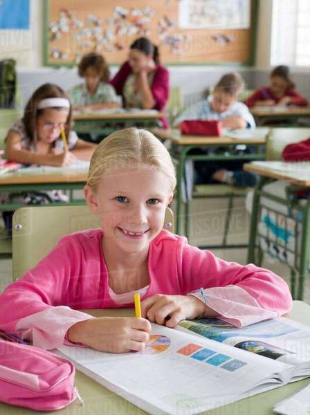 Girl in classroom - Stock Photo - Dissolve