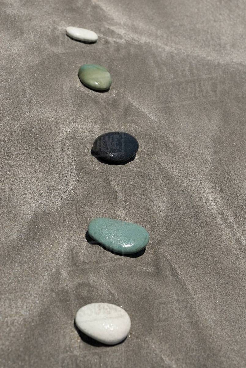 Pebbles in sand - Royalty-free Stock Photo | Dissolve