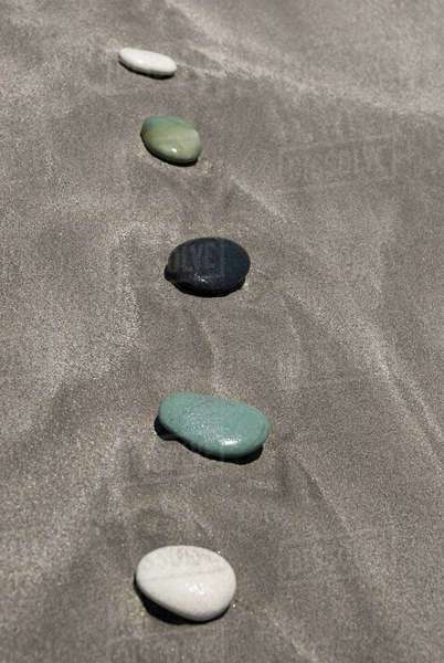 Pebbles in sand - Royalty-free Stock Photo | Dissolve