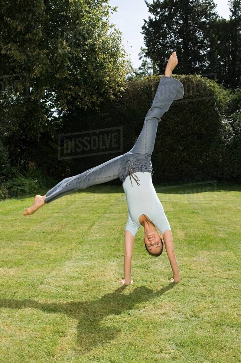 Woman cartwheeling - Stock Photo - Dissolve