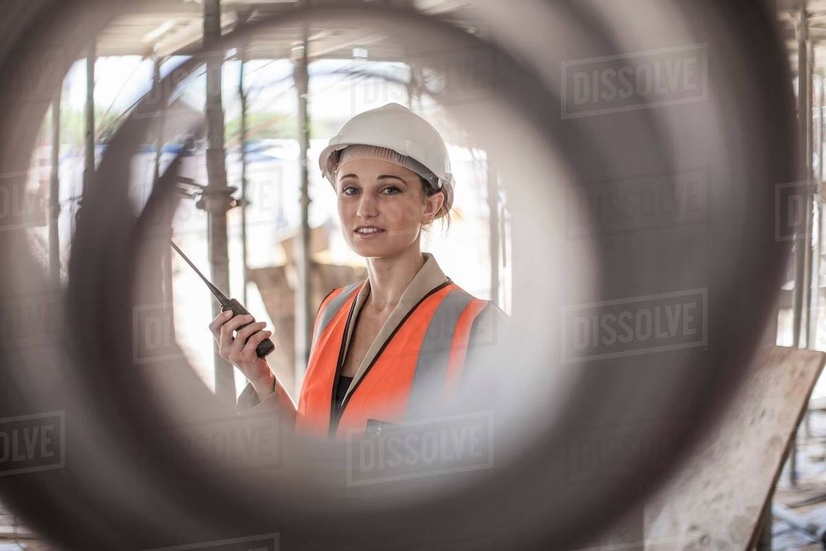 Portrait of female builder on construction site - Royalty-free Stock ...