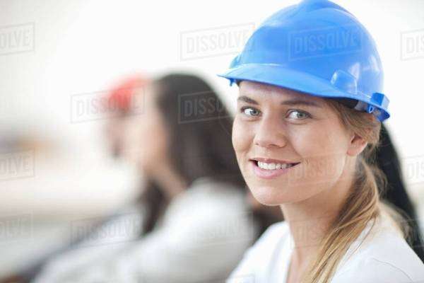 Female laborer smiling - Royalty-free Stock Photo | Dissolve