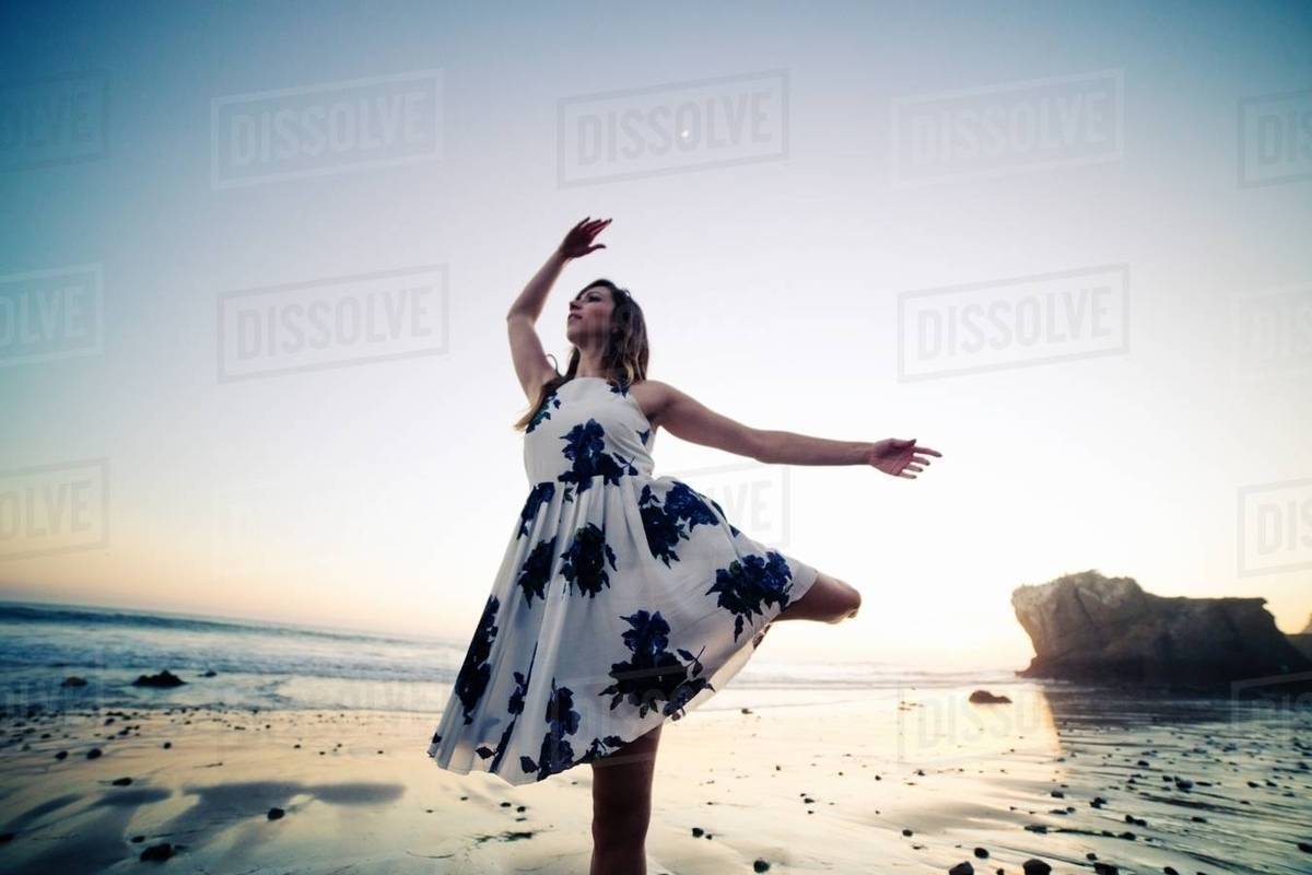 Ballerina dancing on beach - Royalty-free Stock Photo | Dissolve