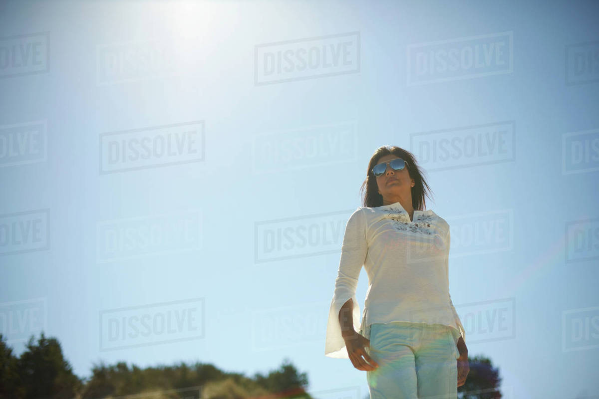Woman under hot sun - Royalty-free Stock Photo | Dissolve