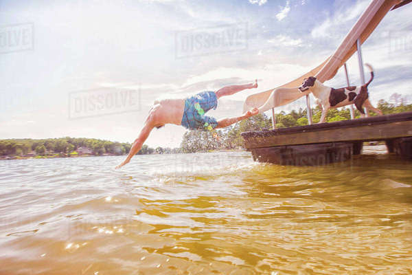 Man diving head first from pier slide at Jackson Lake, Georgia, USA ...