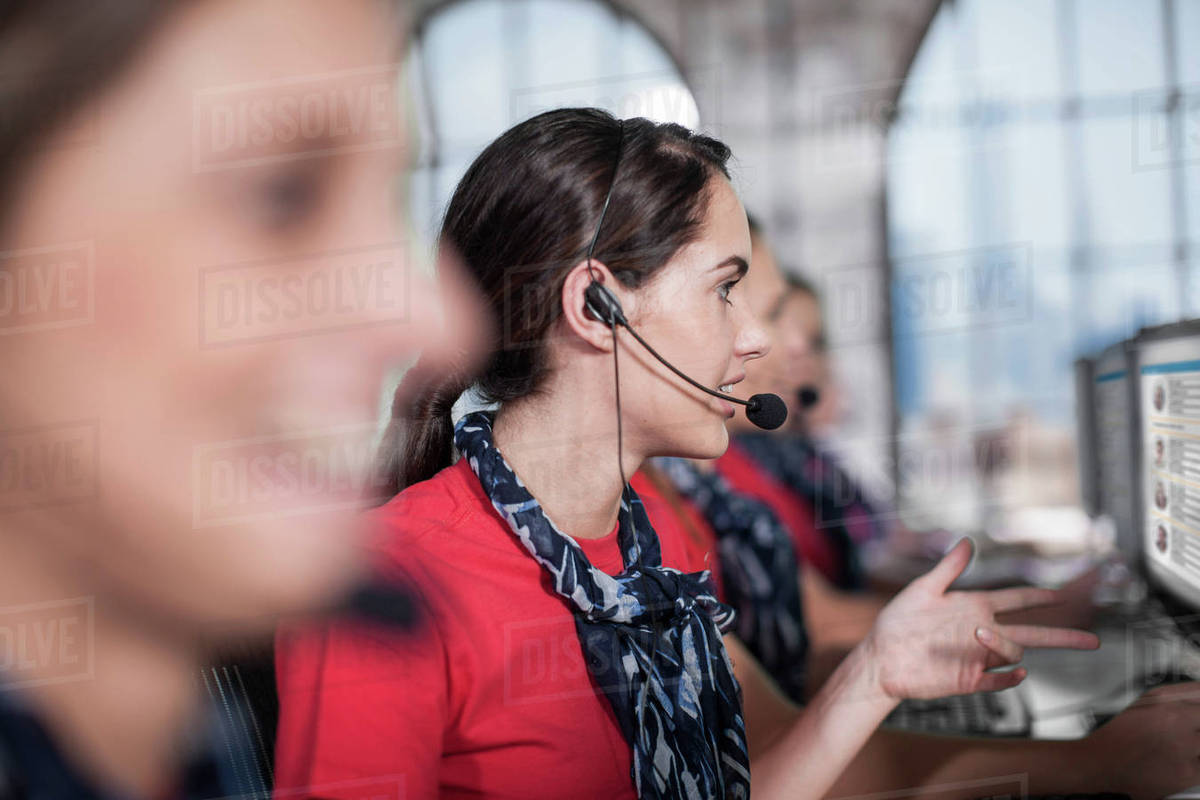 Row of female telephonists working in call centre - Royalty-free Stock ...
