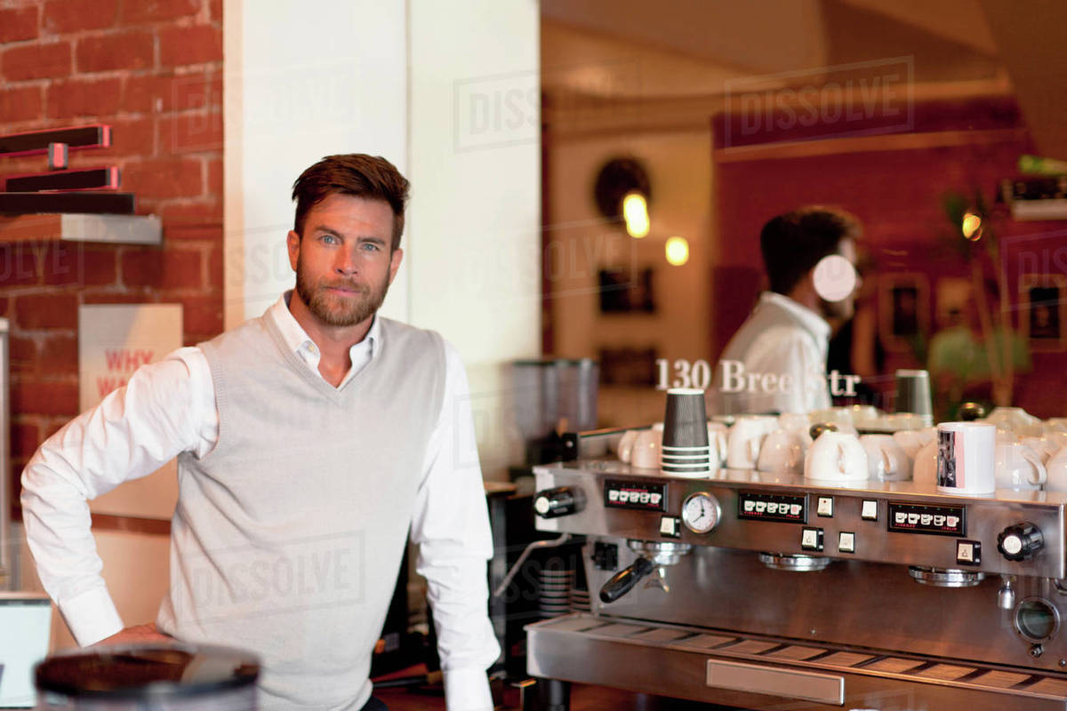 Portrait of mature man behind counter in cafe - Royalty-free Stock ...