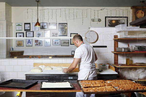Baker working in bakery - Royalty-free Stock Photo | Dissolve