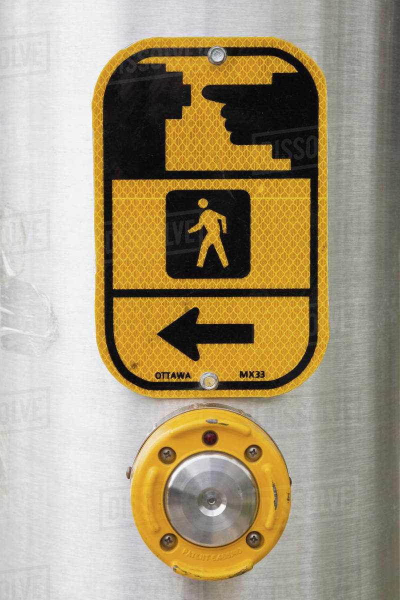 Button and instruction sign on pedestrian crossing - Stock Photo - Dissolve
