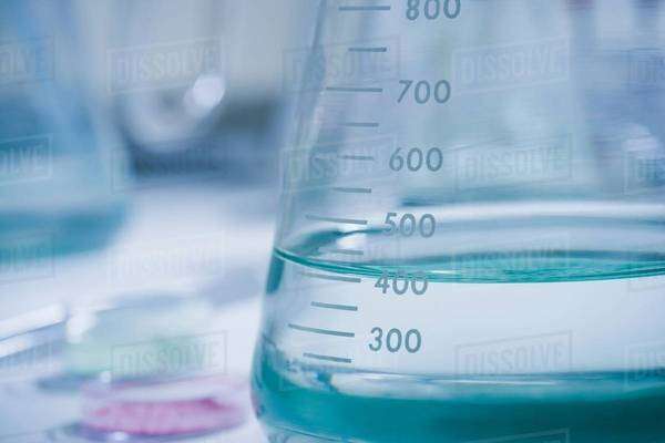 Numbers on conical flask, close up - Royalty-free Stock Photo | Dissolve