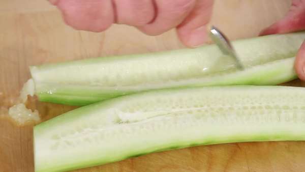 Deseeding a cucumber - Stock Video Footage - Dissolve