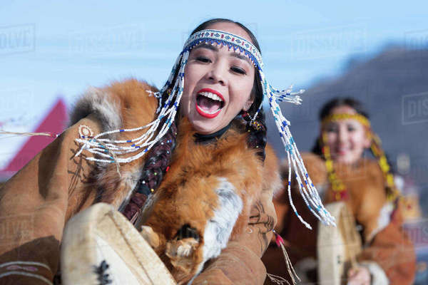 Female dancing with tambourine in national clothing indigenous ...