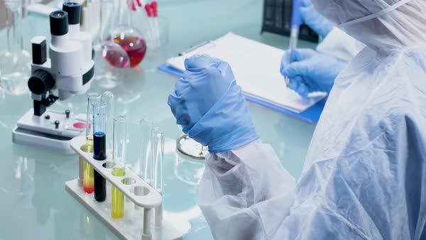 Researcher working in high security laboratory. Close up shot - 4K ...