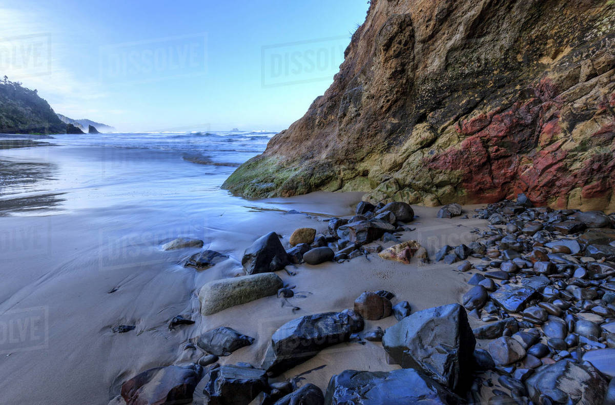Looking out from a small cave at the ocean on Hug Point Beach in ...
