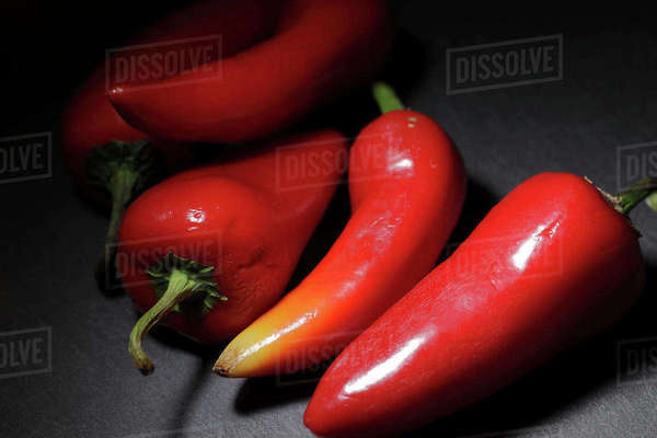 A close up of spicy red chili peppers in a studio setting. - Royalty ...