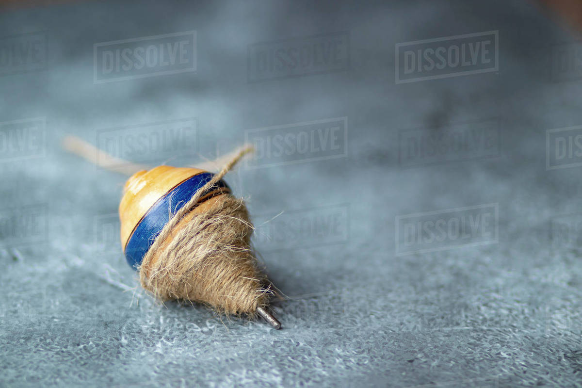 Classic wooden spinning top toy with string - Royalty-free Stock Photo ...