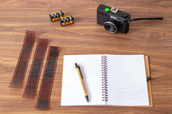 Checking the images of my analog camera, next to my notes - Royalty ...