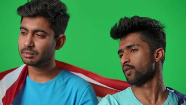 Two stressed disappointed football fans on green screen watching match ...