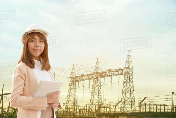 Smart Young beautiful Electrical engineer woman working using tablet ...