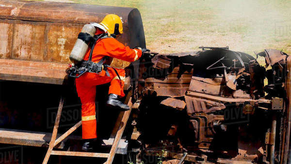 Firefighter fighting with flame using fire hose chemical water foam ...