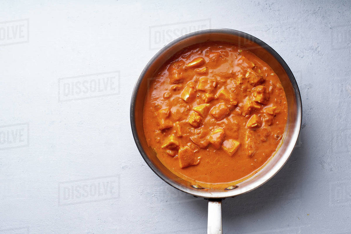 Paneer tikka masala in steel pan on concrete background. Indian cuisine ...