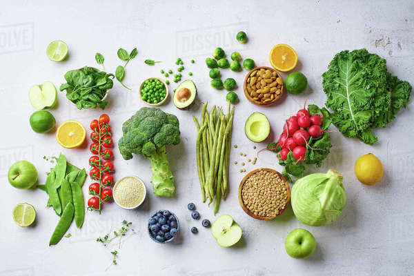 Creative flat lay with healthy vegetarian meal ingredients. Raw food ...