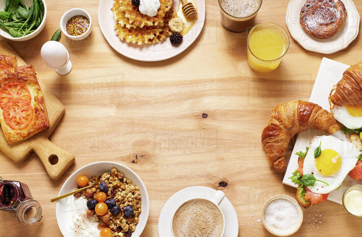 Overhead shot of brunch menu on wooden table with copy space. Healthy ...